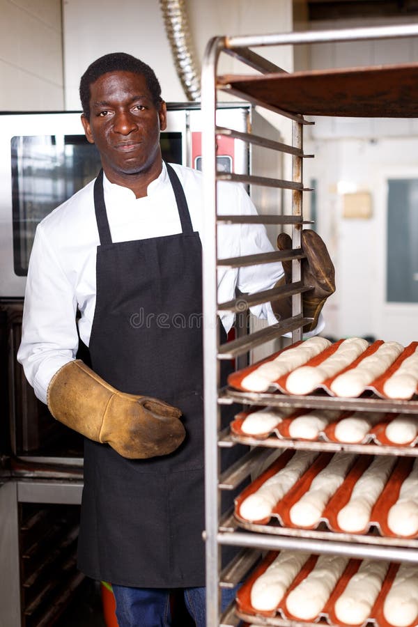 Baker Workin in Kitchen of Bakeshop Stock Image - Image of food ...