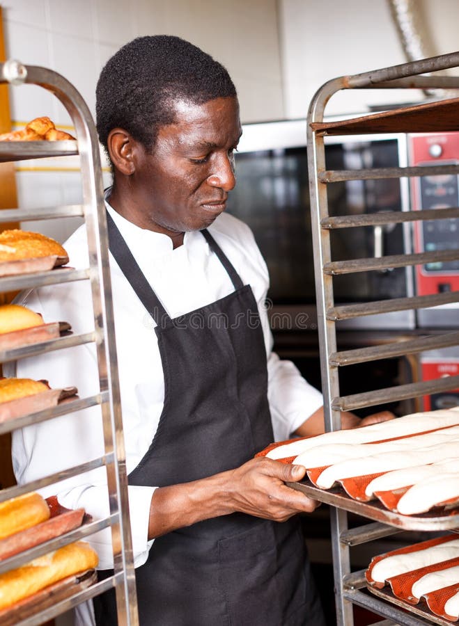 Baker Workin in Kitchen of Bakeshop Stock Photo - Image of producing ...