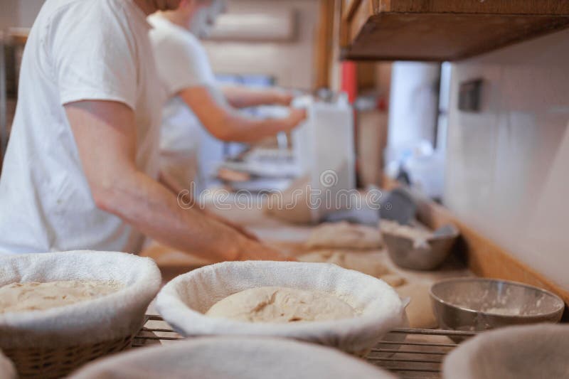Baker Working in the Kitchen, Preparing Loaves of Bread Stock Image ...