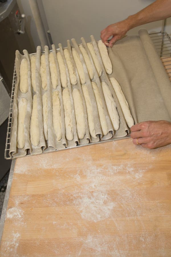 Baker Working with Uncooked Dough Forming it into Long Rolls Stock ...