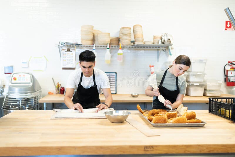 Bakers Busy at Work in a Bakery Stock Photo - Image of focused, adult ...