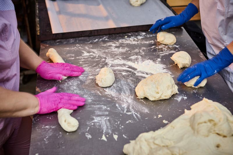 Bakers Hands Form Dough for Baking Bread and Put it into Oven-tray at ...