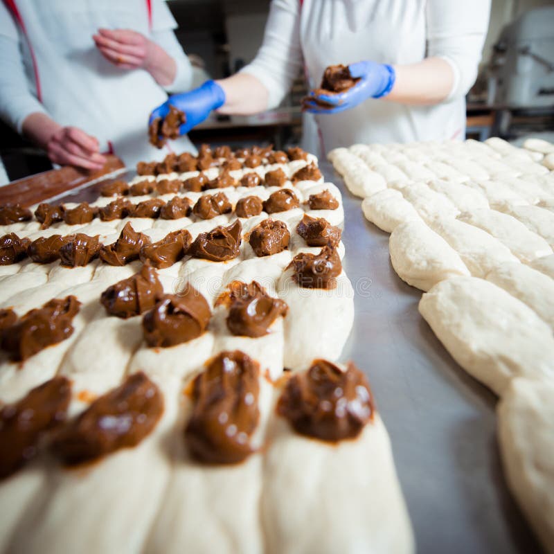 Bakers Make Buns from Dough with Filling of Condensed Milk Stock Photo ...