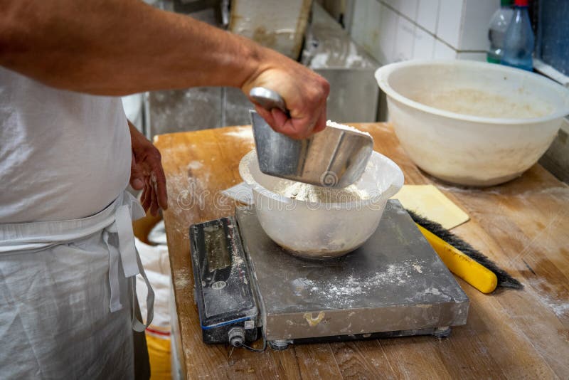 In Bakery a Baker Mixes the Ingredients for a Bread Dough Stock Photo ...