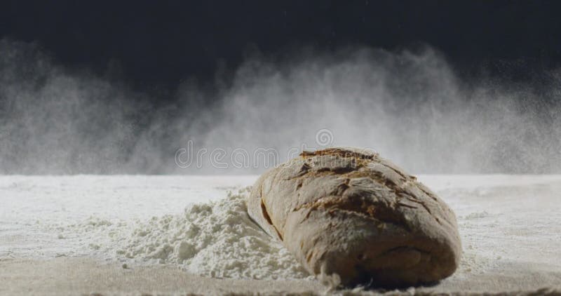 Bakery and Cooking Concept. Fresh Bread with a Splash Falls into Flour ...