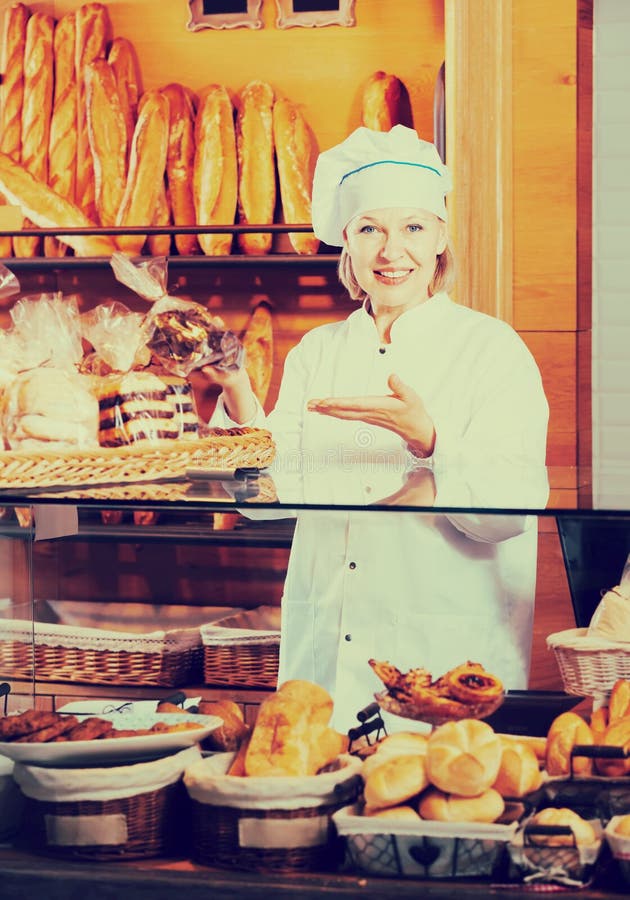 Bakery Employee Offering Bread Stock Image - Image of filled, pastry ...