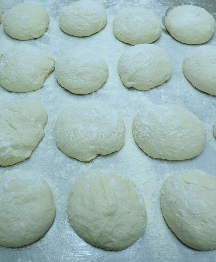 At the Bakery: Formed and Floured Dough Placed on the Work Table Stock ...