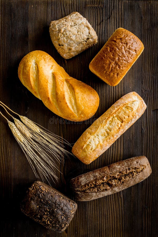 Bakery. Fresh Bread in Assortment on Wooden Table Top-down Stock Photo ...