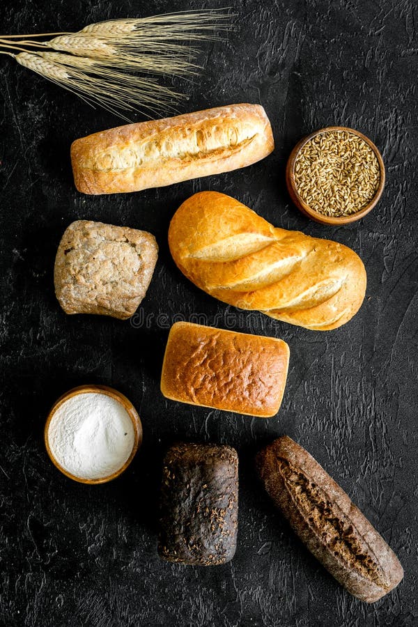 Bakery. Fresh Bread in Assortment on Yellow Table Top-down Stock Image ...