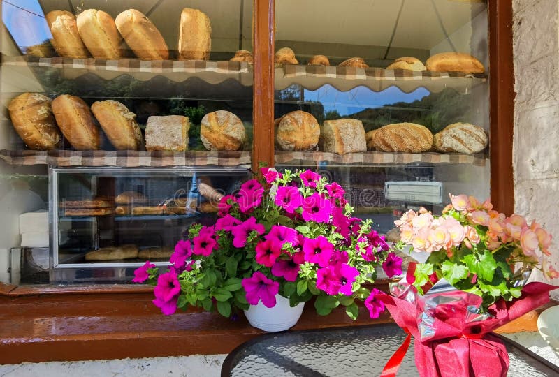 Bakery Frontstore with Breads and Flowers on the Table Stock Image ...