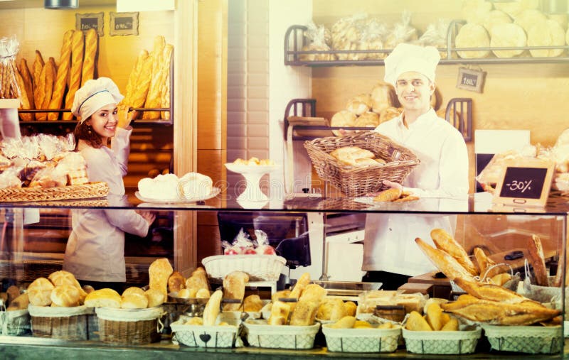 Bakery Staff Offering Bread and Different Pastry Stock Image - Image of ...