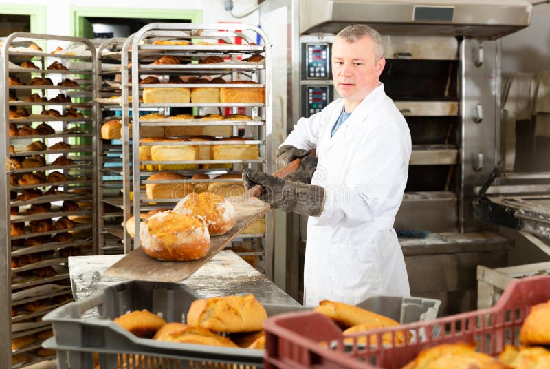 Bakery Worker Making Bread stock image. Image of crust - 268108033
