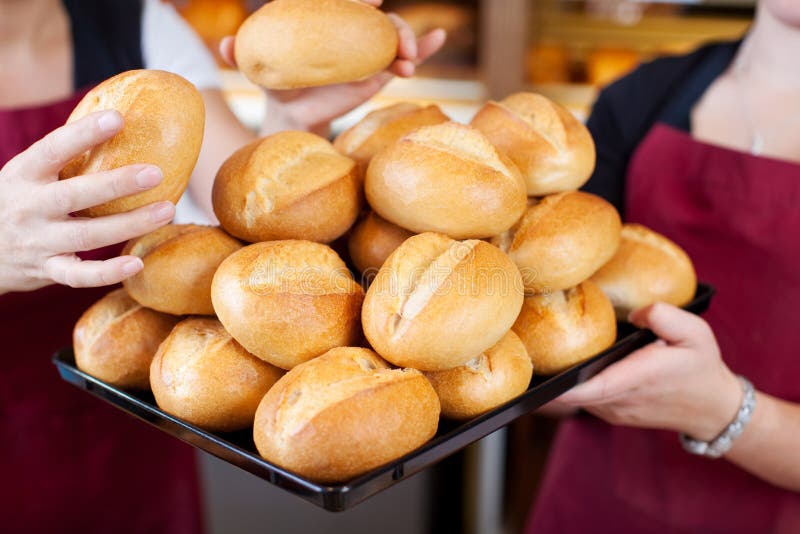 Bakery Worker Stacking Bread Rolls in Tray Stock Image - Image of ...
