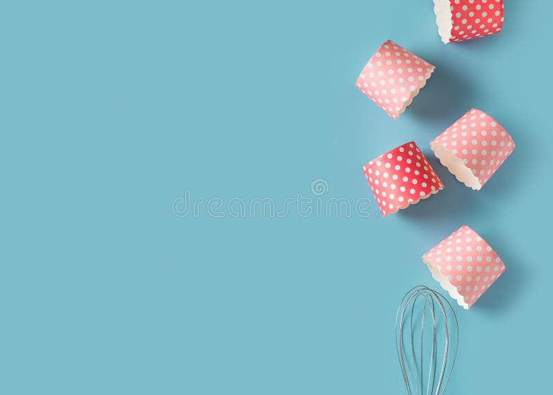 Baking Background with Pink Cake Forms on Blue Background Stock Image ...
