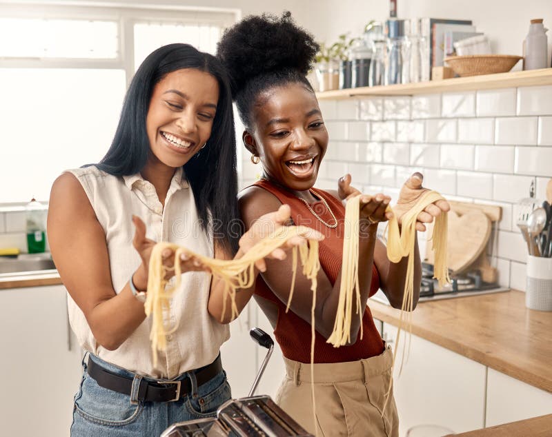 Baking is Better with a Friend. Two Young Friends Cooking Together at ...