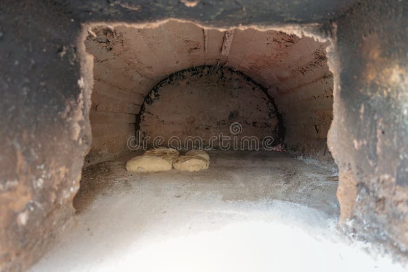 Baking Bread in a Clay Oven on Fire Stock Photo - Image of cookery ...