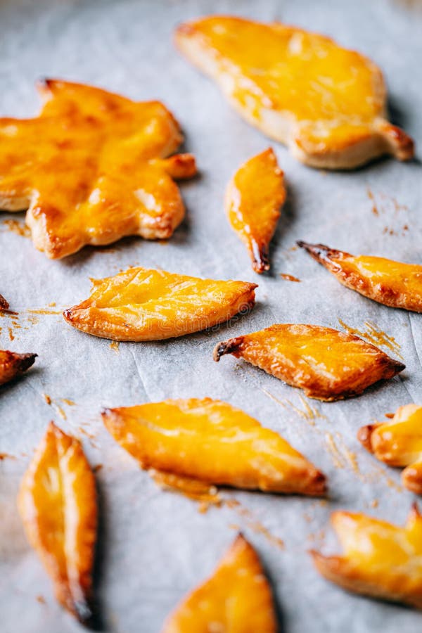 Baking Cookies in the Form of Autumn Leaves on Parchment Paper Stock ...