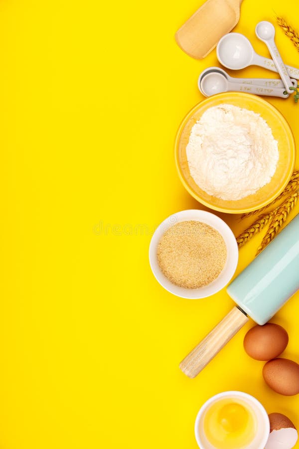 A Variety of Ingredients for Baking on a Pastel Yellow Background ...