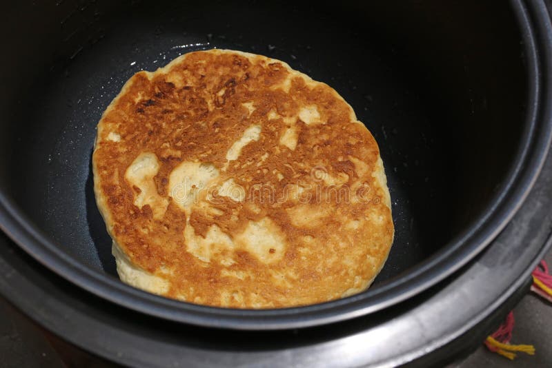 Baking Flatbread in the Multicooker Kitchen Machine. Stock Image ...