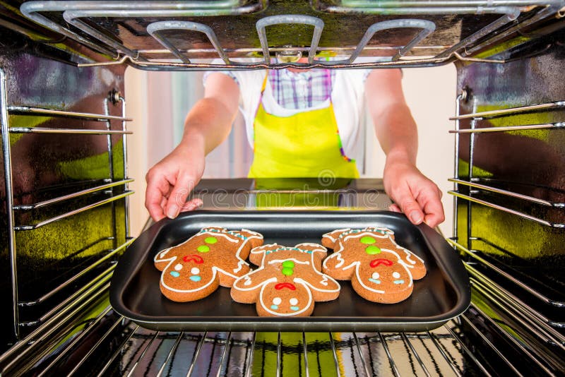 Baking Gingerbread Man in the Oven Stock Photo - Image of grimace, bath ...