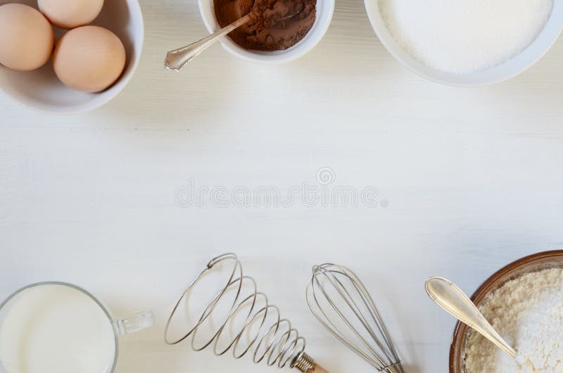 Baking Ingredients on a Dark, Stone Table: Eggs, Flour and Milk Stock ...