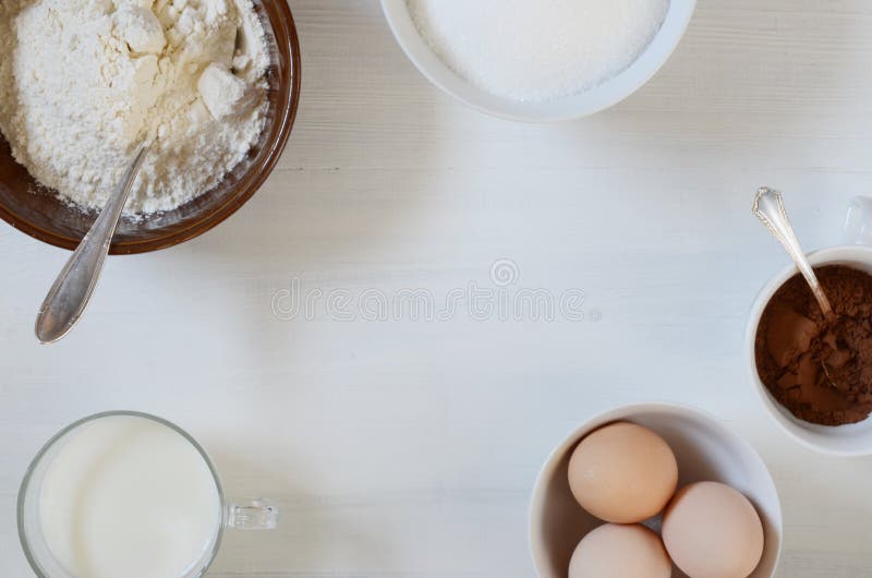 Baking Ingredients on a Dark, Stone Table: Eggs, Flour and Milk Stock ...