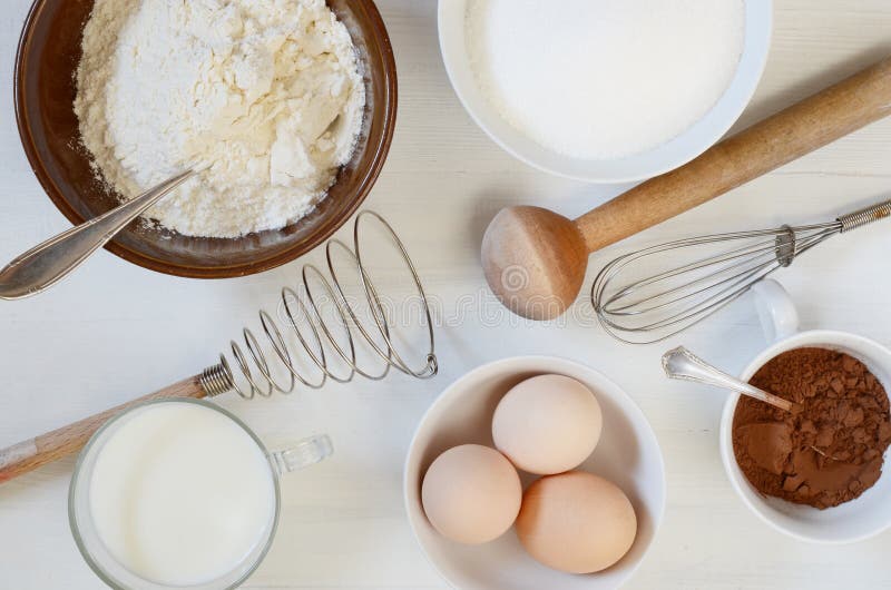 Baking Ingredients on a Dark, Stone Table: Eggs, Flour and Milk Stock ...