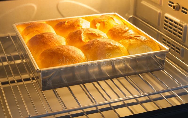 Baking a loaf of bread stock photo. Image of manufacturing - 141677638