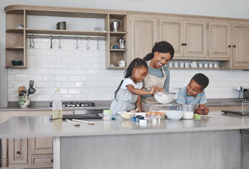 Baking Makes Me Focus. a Mother Baking with Her Children at Home. Stock ...