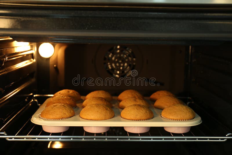 Baking Pan with Cupcakes in Modern Oven Stock Photo - Image of baking ...