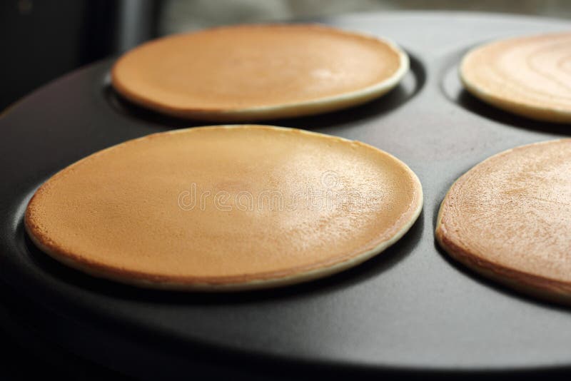 Baking Pancakes on a Crepe Maker Stock Photo - Image of closeup, food ...