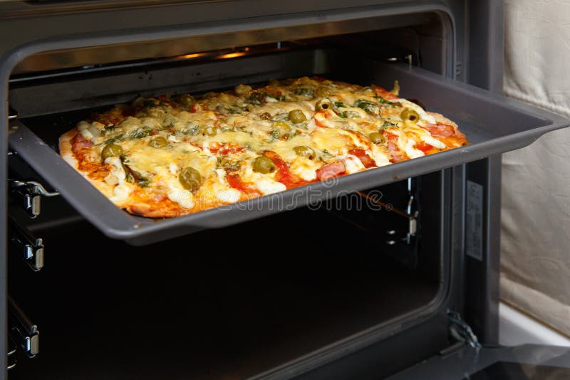 Baking pizza in oven. stock image. Image of fireproof - 45097943