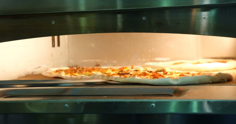 Baking Pizza in Traditional Wood Fired Oven on Naples Street Stock ...