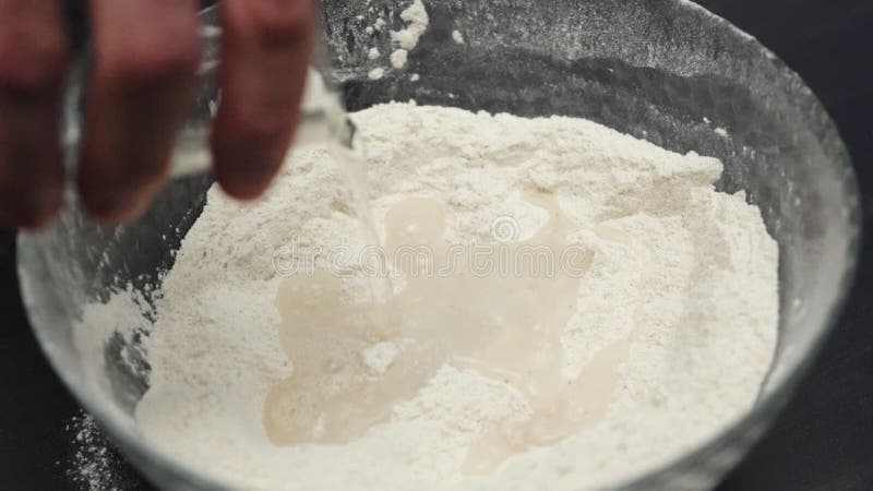 Baking Preparation: Mixing Flour and Sugar with Water Stock Footage ...