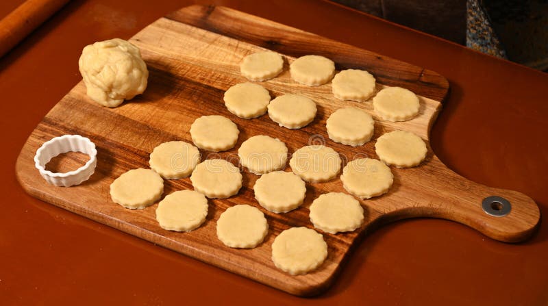 Baking Process with Freshly Rolled Cookie Dough Shapes on a Wooden ...