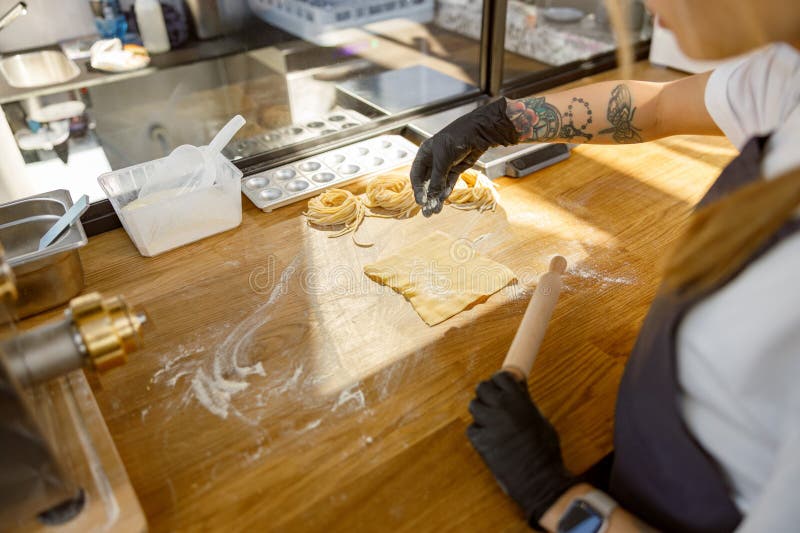 The Baking Process Rolling Dough with Great Precision and Care in the ...