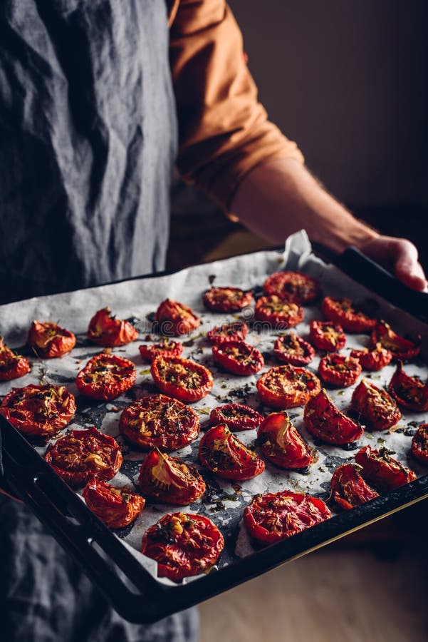 Baking Sheet Full of Freshly Cooked Sun Dried Tomatoes with Thyme Stock ...