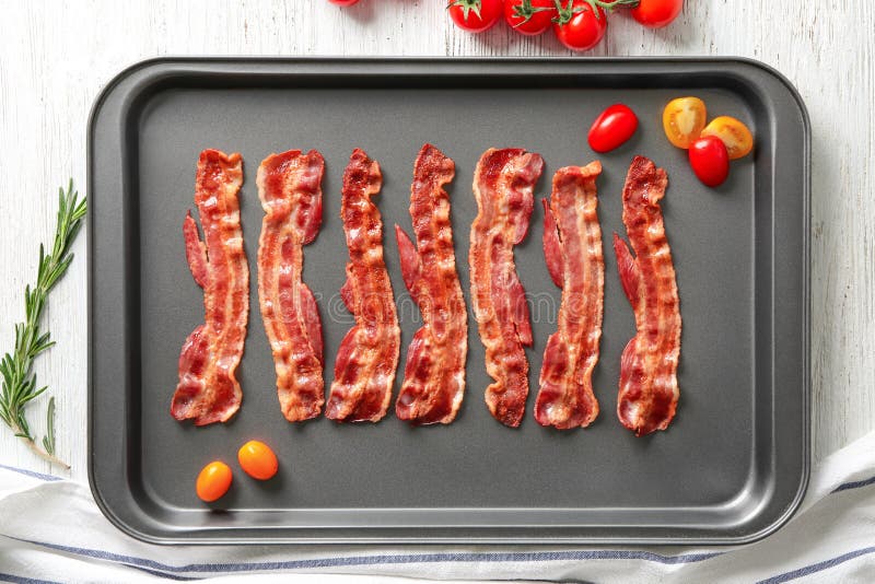 Baking Sheet with Tasty Bacon on Table Stock Photo - Image of piece ...