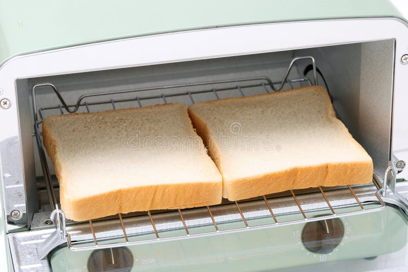 Baking Two Slices Toast Bread with Toaster Oven Stock Photo - Image of ...