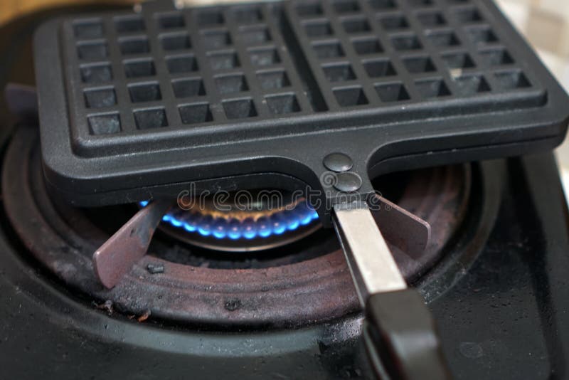 Baking Waffles on a Gas Stove Stock Photo - Image of homemade, cooking ...