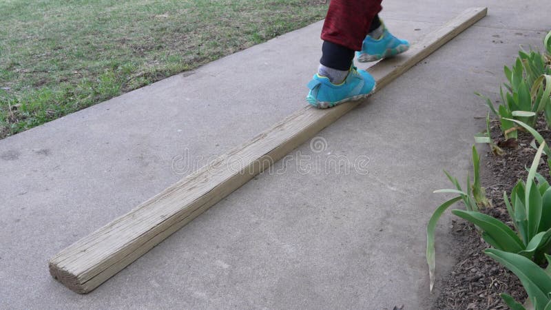 Balance Exercise - Feet of a Man Walking Back and Forth on a Wobbly 2x4 ...