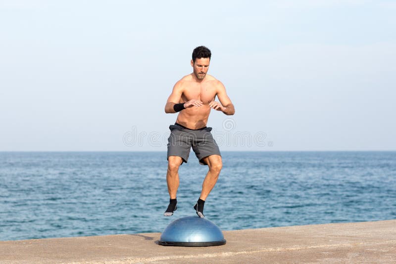 Balance Exercise on Platform with Coach by Sea Stock Image - Image of ...