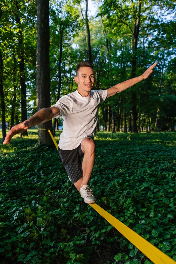 Man in Sportswear Balancing on the Rope Stock Image - Image of walker ...