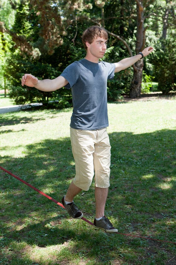 Balance on Slackline stock image. Image of trend, funsport - 19704759