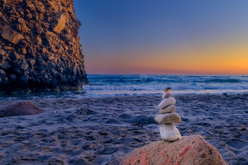 Balance Stone Stack and Big Natural Rock on Sandy Beach at Sunset ...