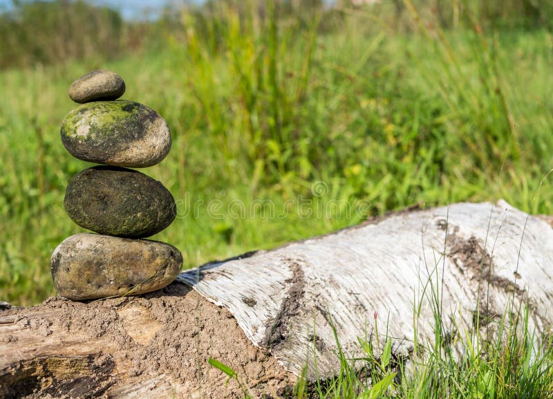 Balance Stones in the Forest on a Log Stock Image - Image of lake ...