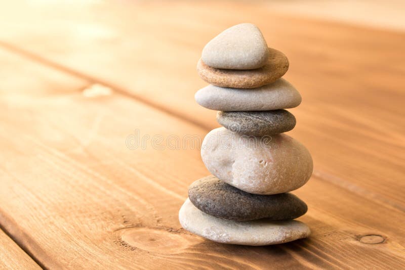 Balance the Stones on the Wooden Table Stock Photo - Image of ...