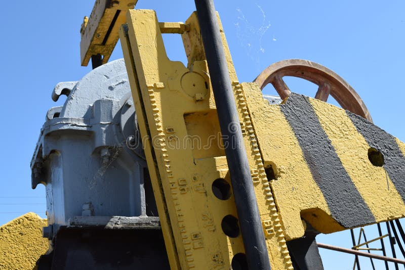 Balance Weight and Reducer Pumping Unit of an Oil Well. Stock Photo ...