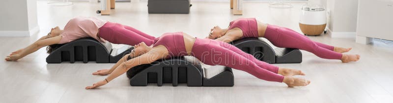 Balanced Body Pilates Arc. Three Asian Women Exercising on Pilates Arc ...