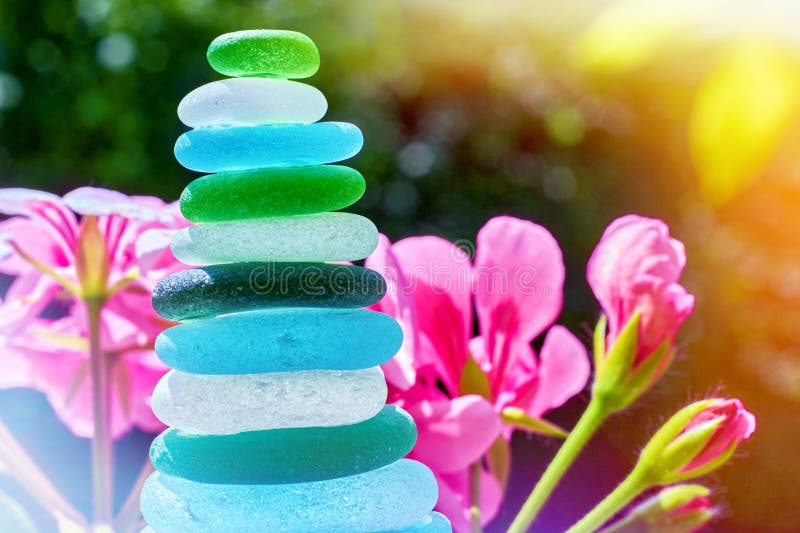 Balanced Pyramid of Multi-colored Glass Sea Stones Against the ...
